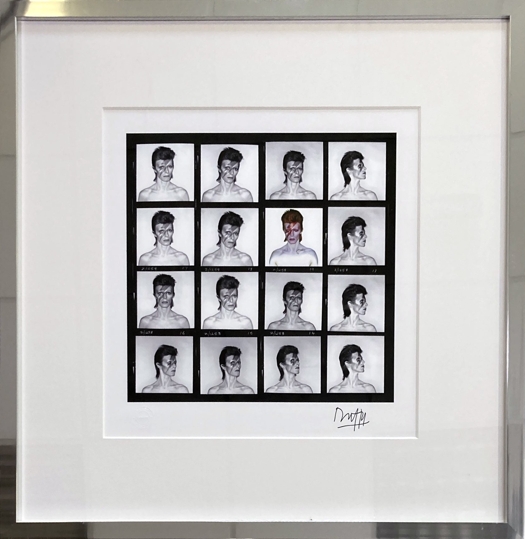 Lot 135 - DAVID BOWIE - A CONTACT SHEET SIGNED BY