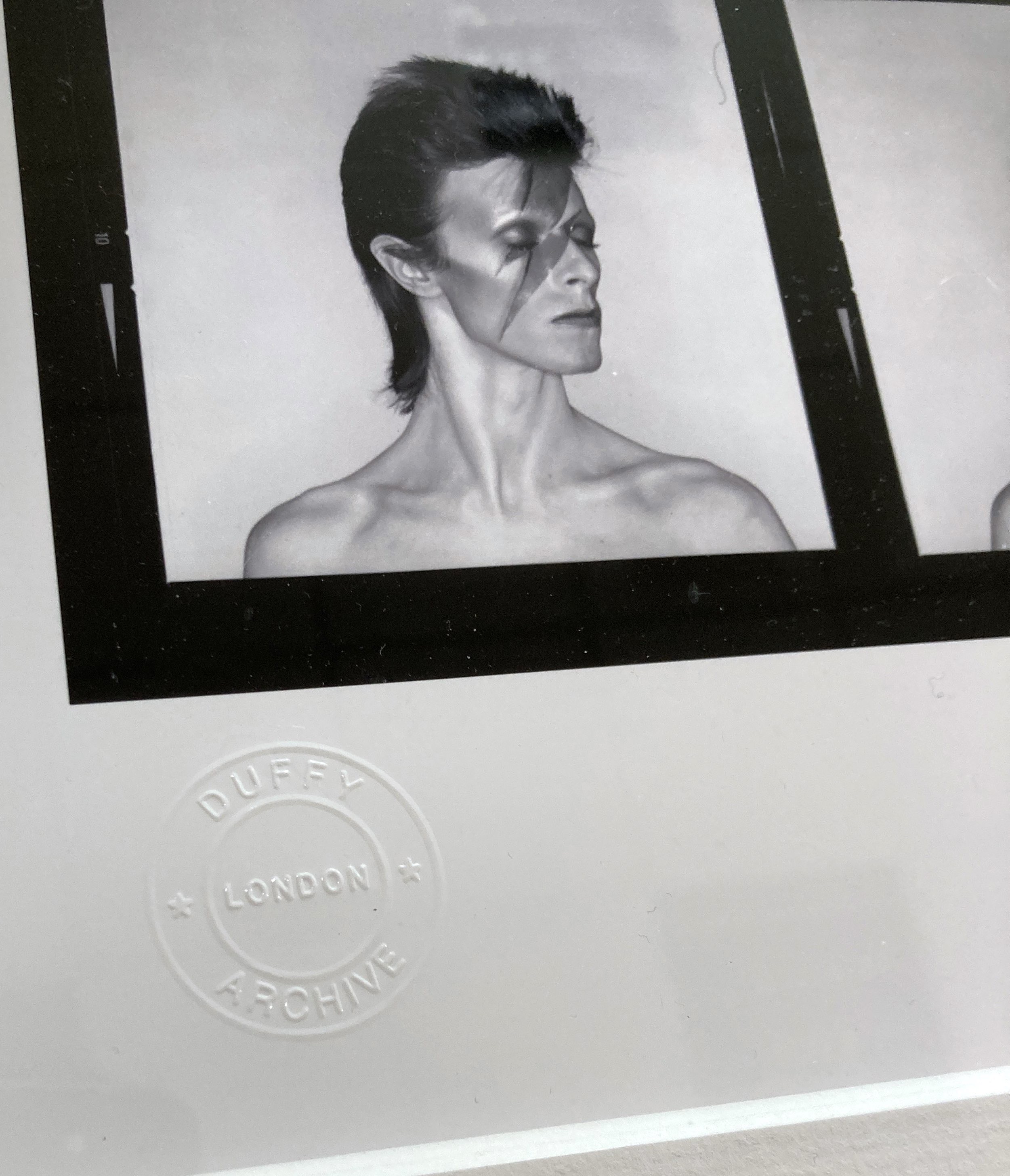 Lot 135 - DAVID BOWIE - A CONTACT SHEET SIGNED BY