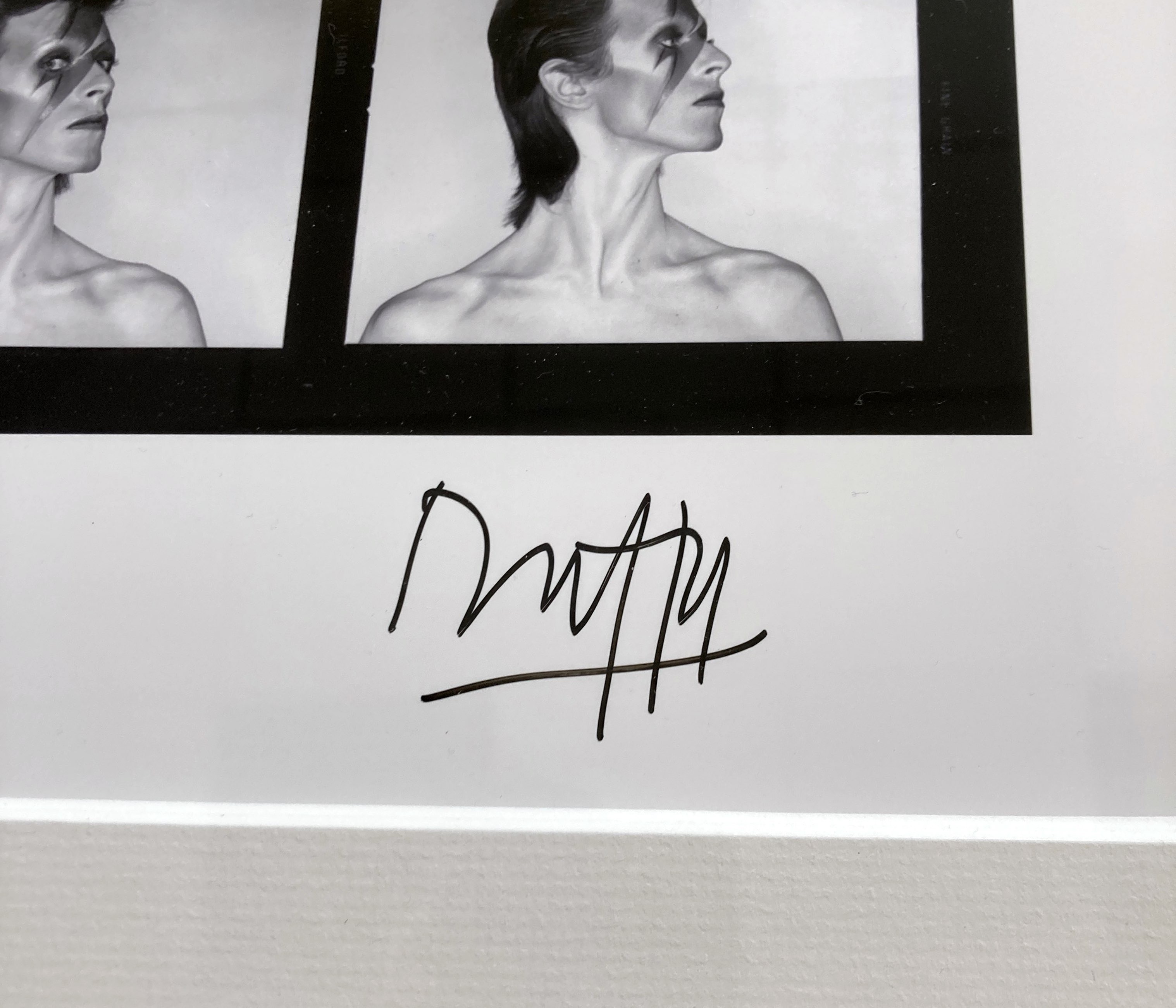 Lot 135 - DAVID BOWIE - A CONTACT SHEET SIGNED BY