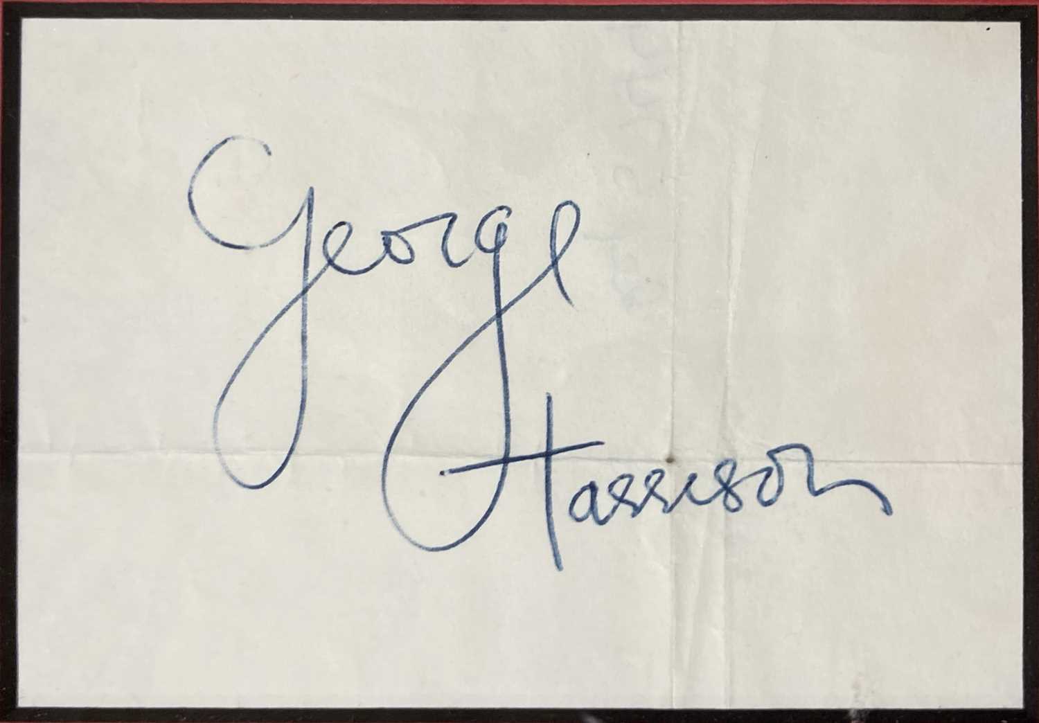 Lot 145 - THE BEATLES - A CUTTING SIGNED BY GEORGE